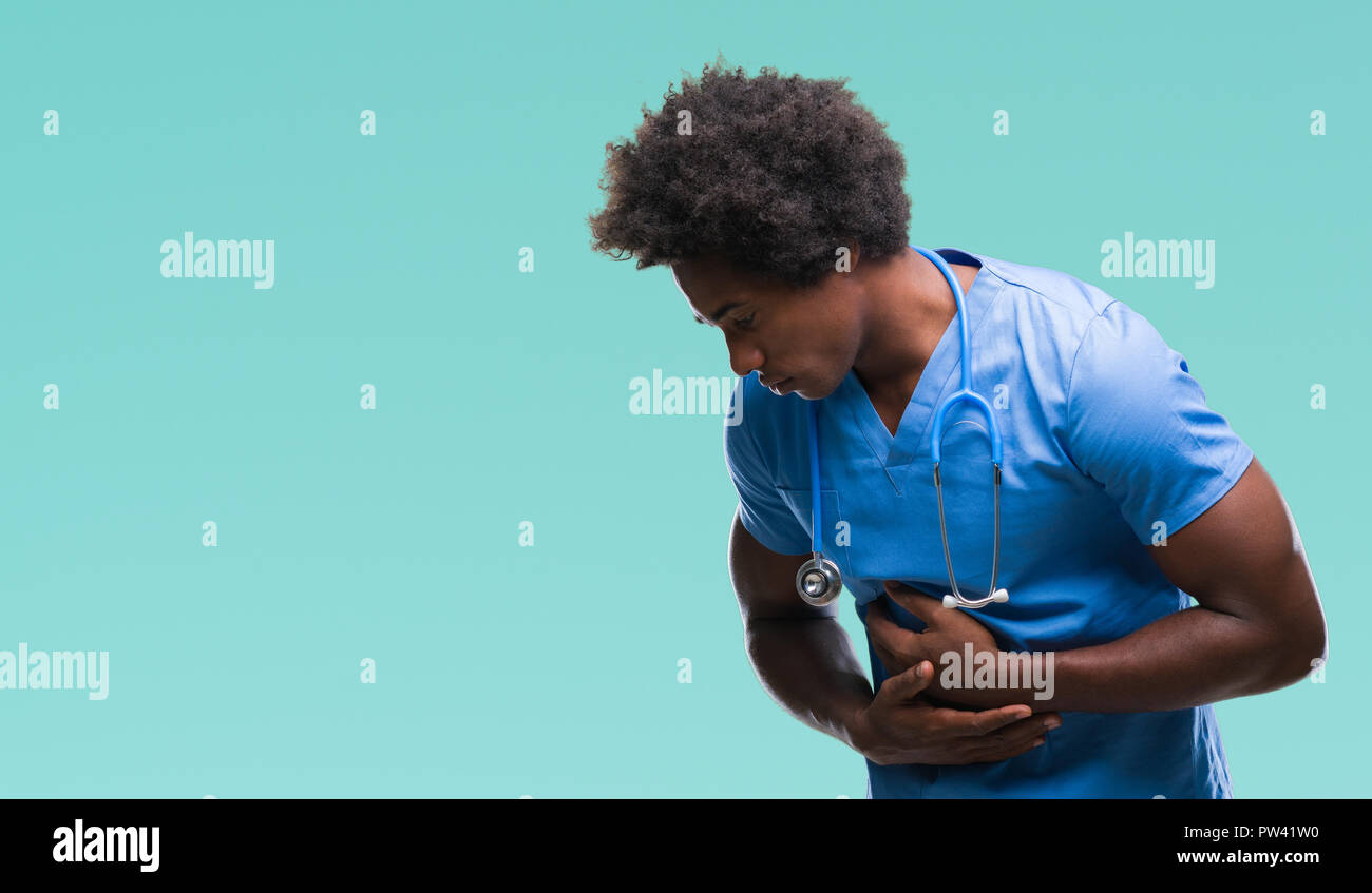 Afro american surgeon doctor man over isolated background with hand on ...