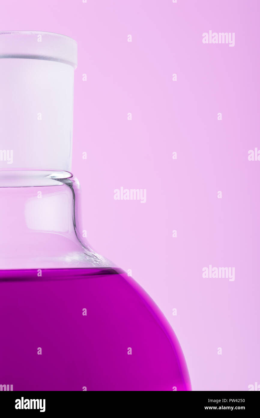 Close up of erlenmeyer flask over pink background Stock Photo - Alamy