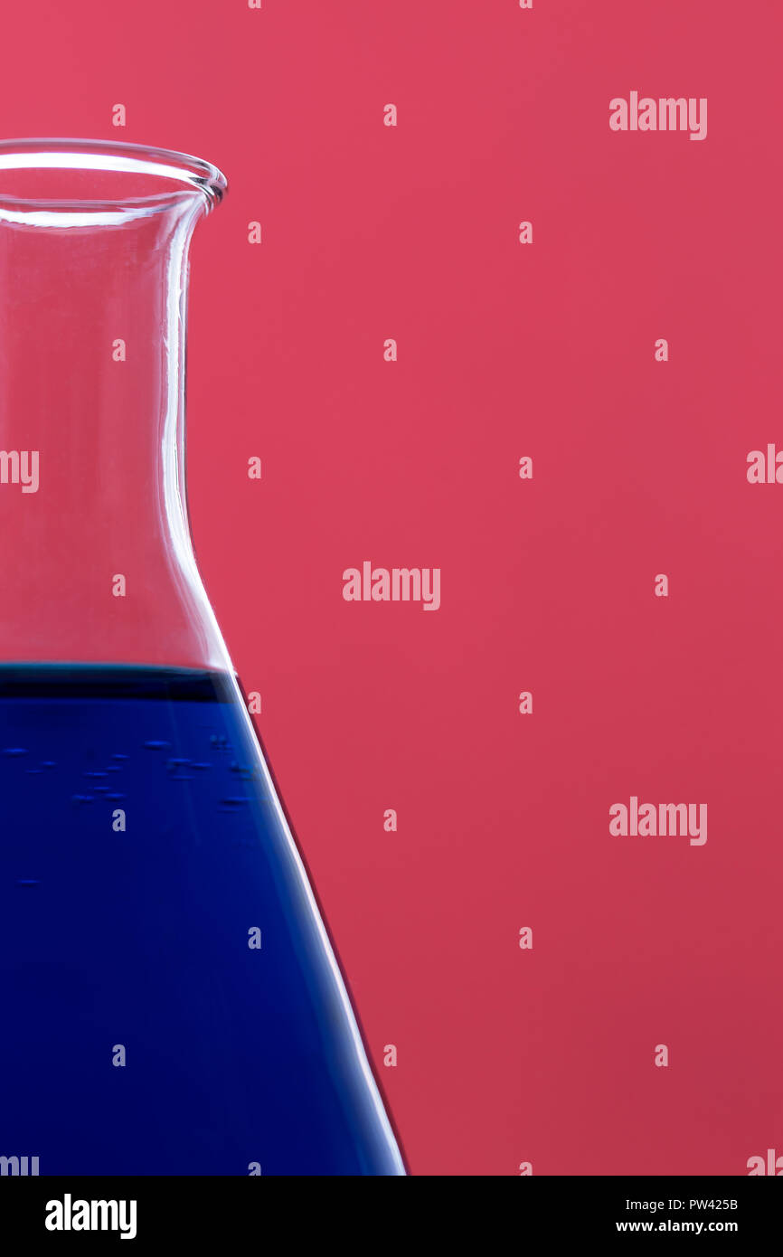 Close up of erlenmeyer flask over pink background Stock Photo - Alamy