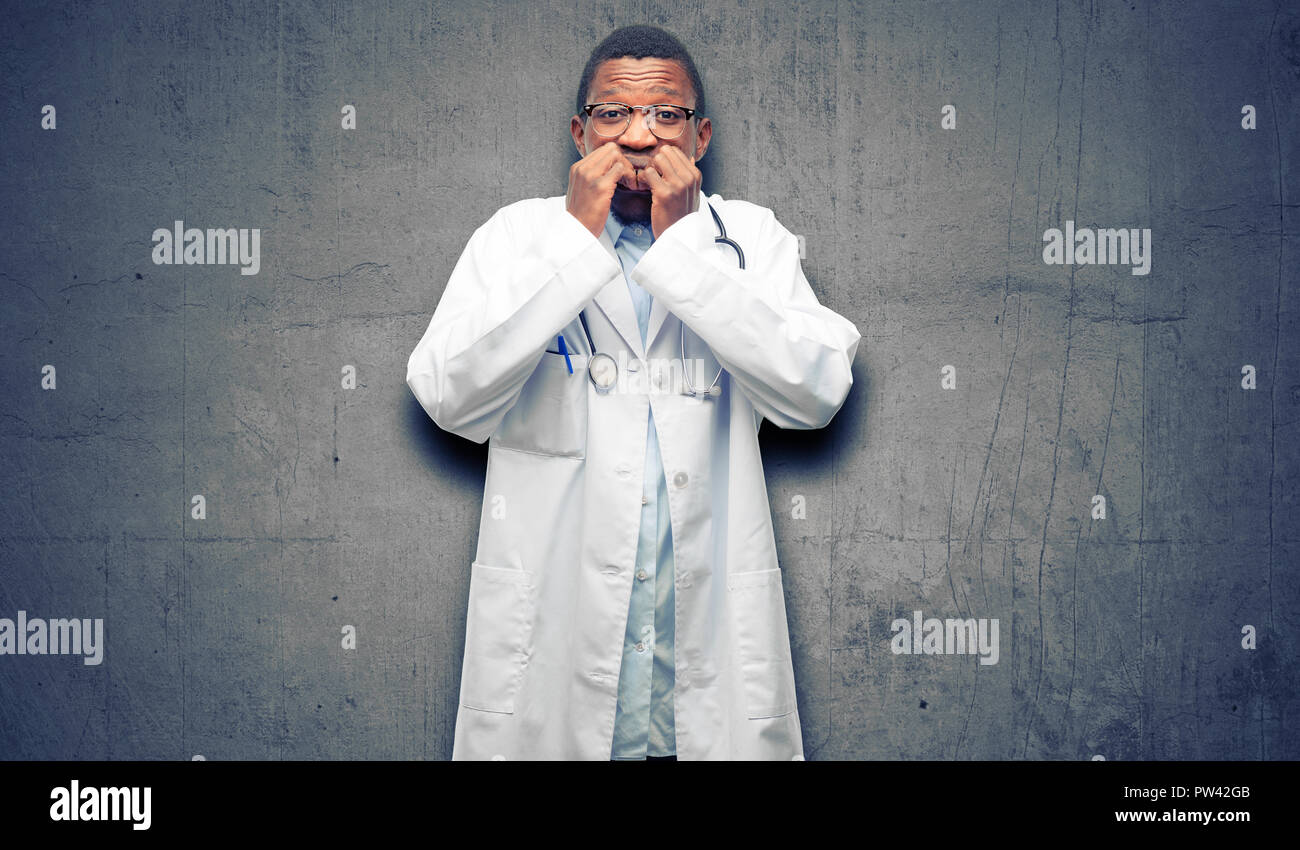 Young black doctor, medical professional terrified and nervous ...
