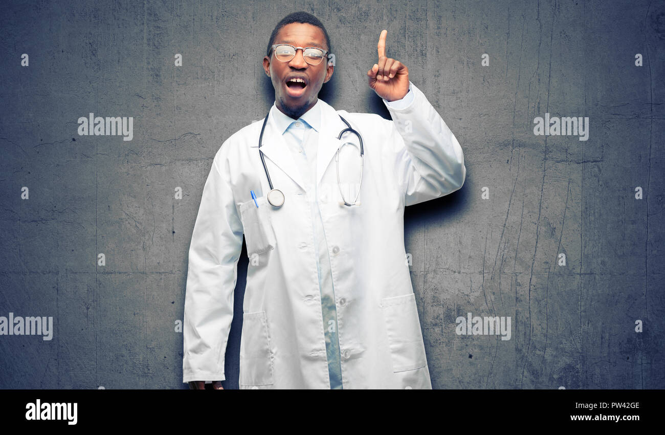 Man doctor laughing pointing finger hi-res stock photography and images ...
