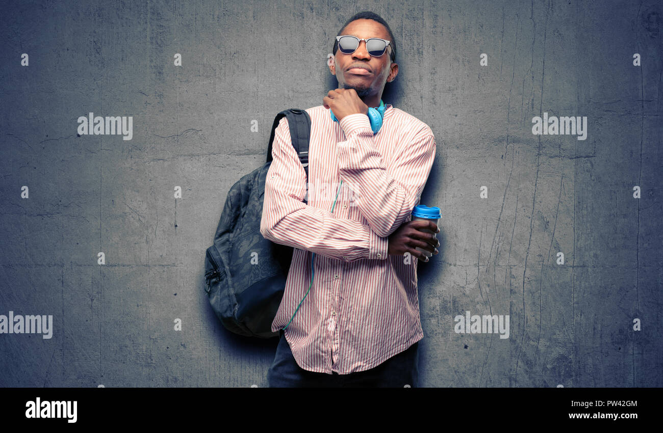 African black man student thinking and looking up expressing doubt and ...