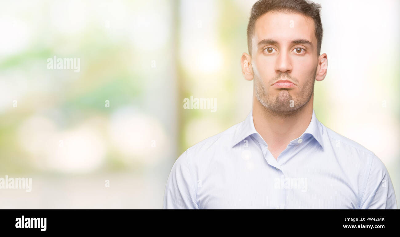 Handsome young businessman depressed and worry for distress, crying ...