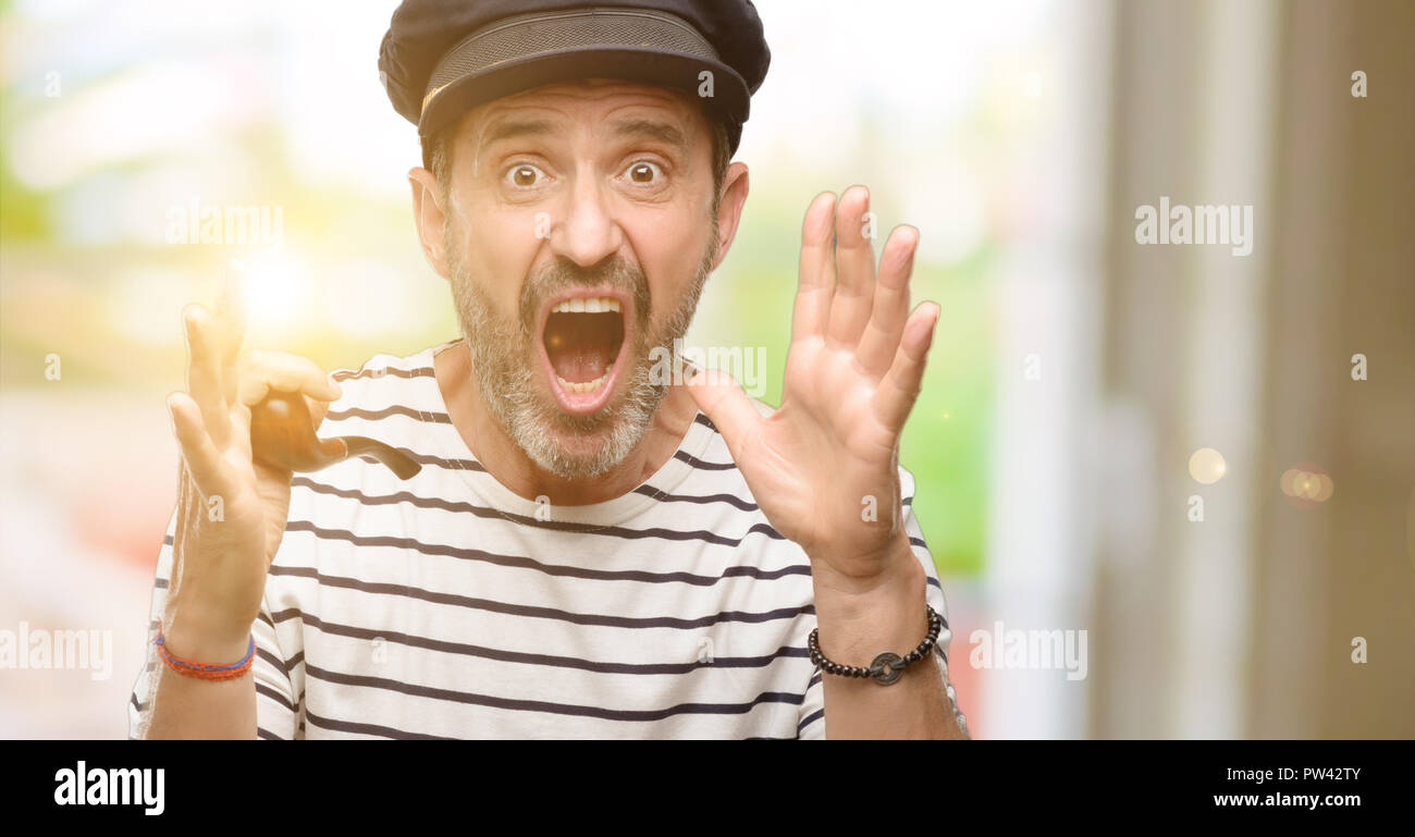 Sailor captain man smoking a tobacco pipe stressful keeping hands on ...