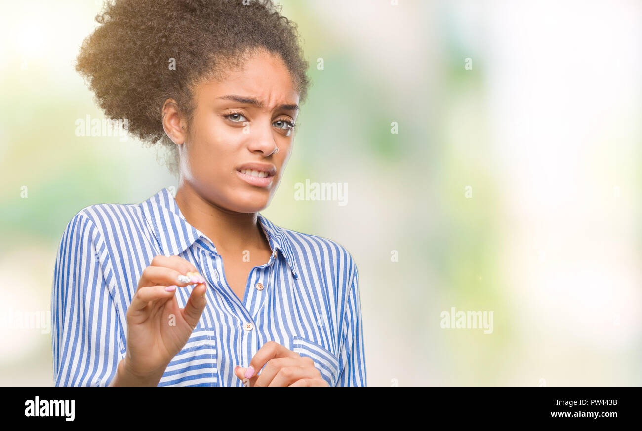 Young afro american woman over isolated background disgusted expression ...