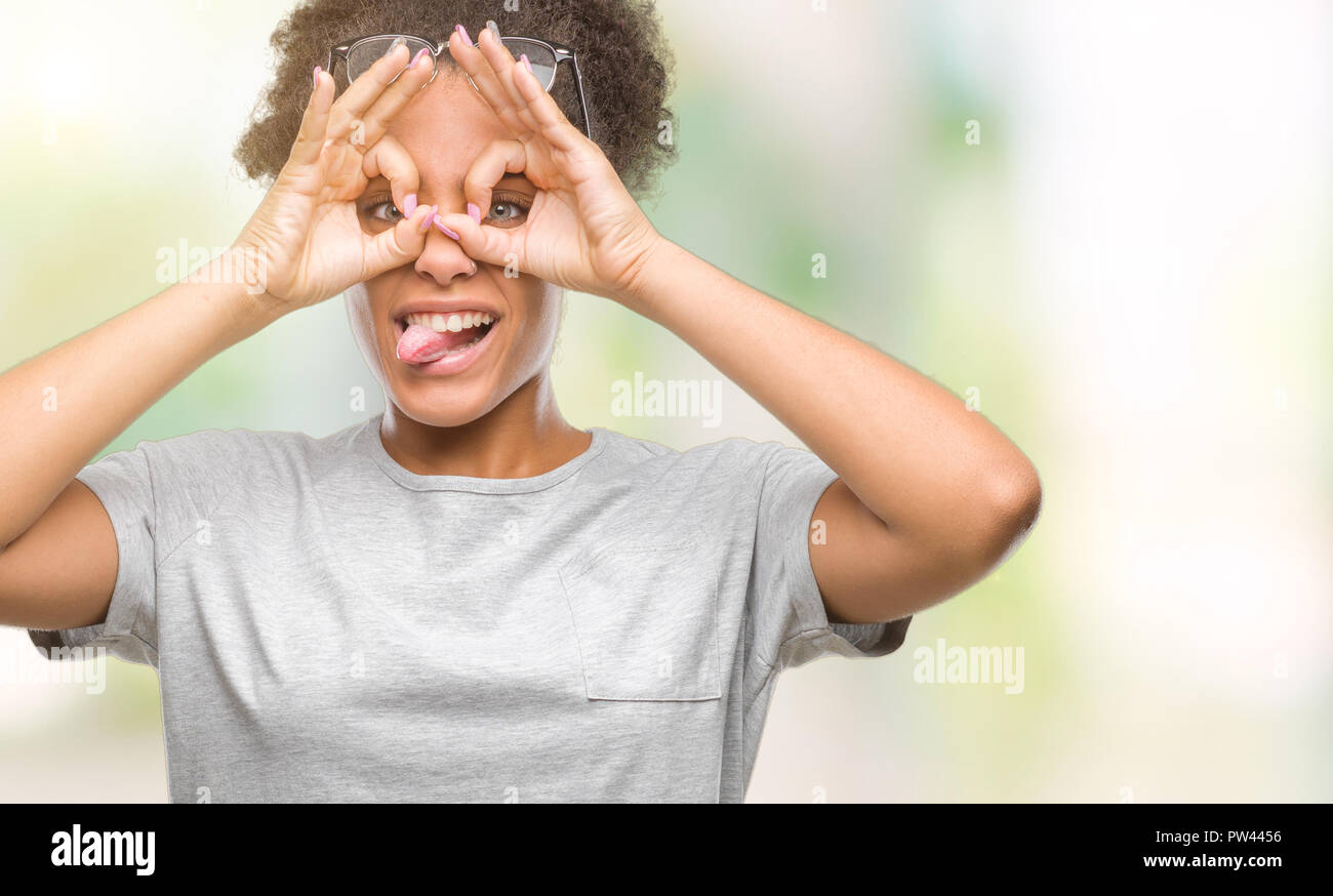 Young afro american woman wearing glasses over isolated background ...