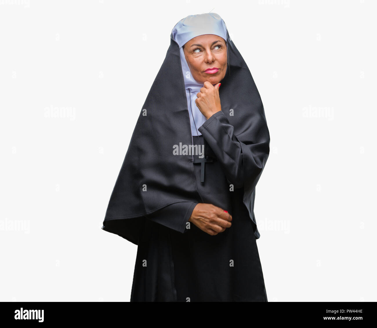 Middle age senior christian catholic nun woman over isolated background ...
