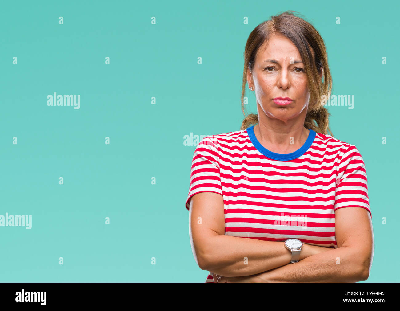 Middle age senior hispanic woman over isolated background depressed and ...