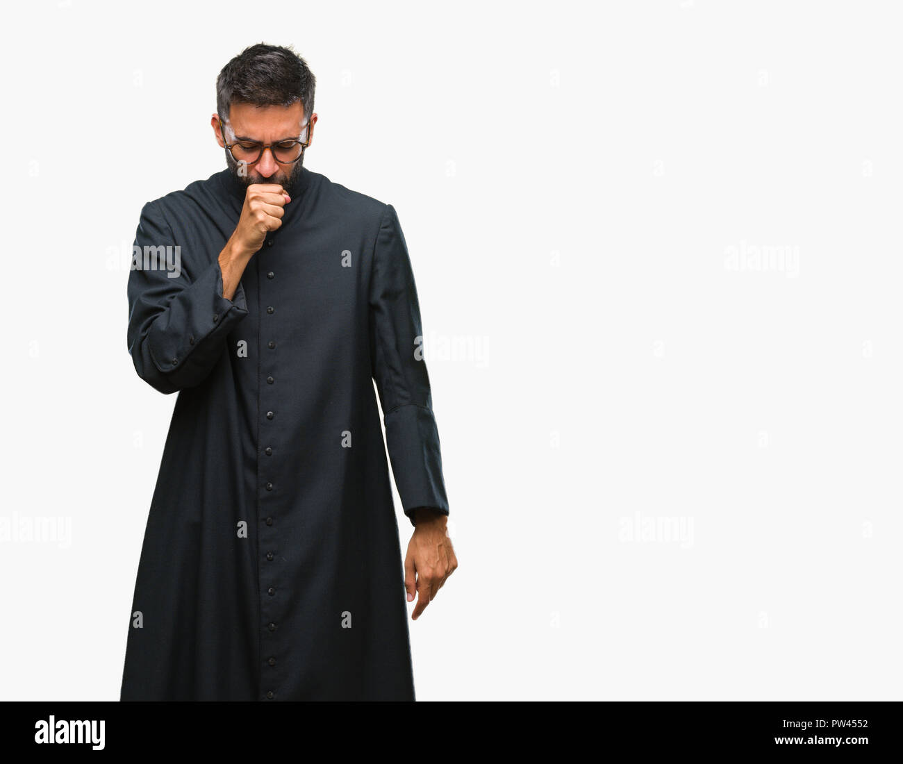 Adult hispanic catholic priest man over isolated background feeling ...