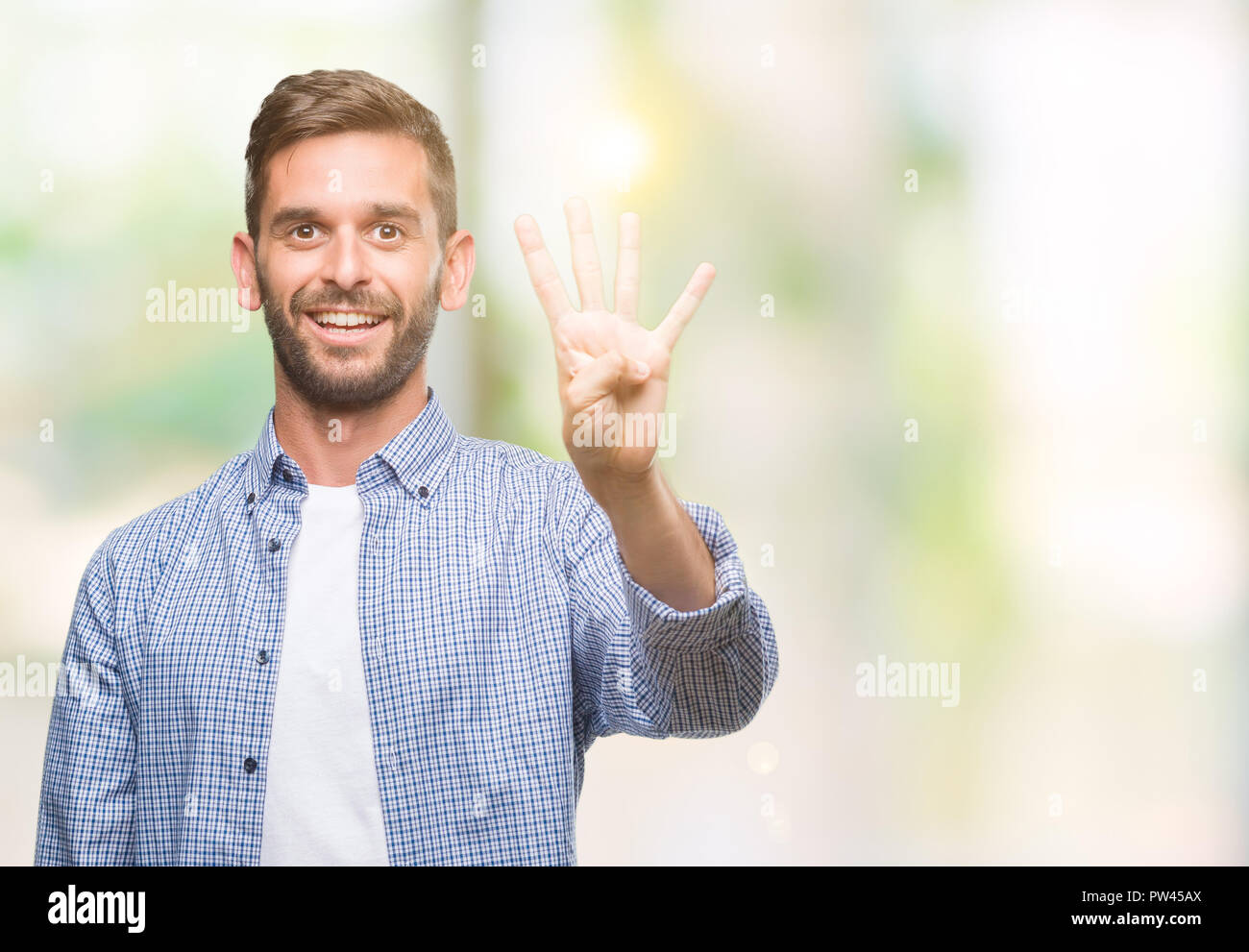 Young handsome man wearing white t-shirt over isolated background ...