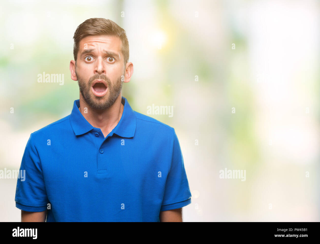 Young handsome man over isolated background afraid and shocked with surprise expression, fear ...
