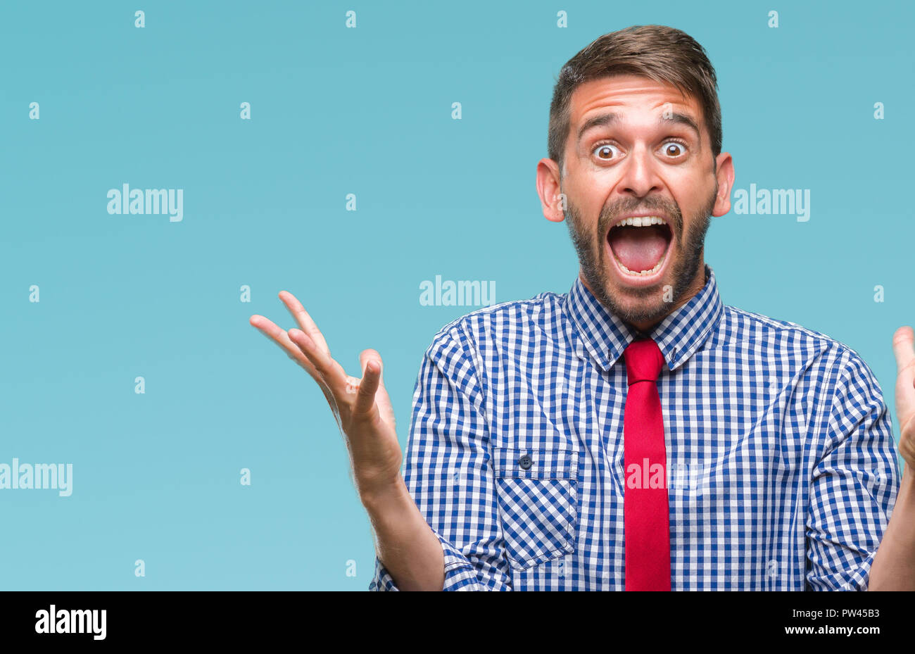 Young handsome business man over isolated background celebrating crazy ...