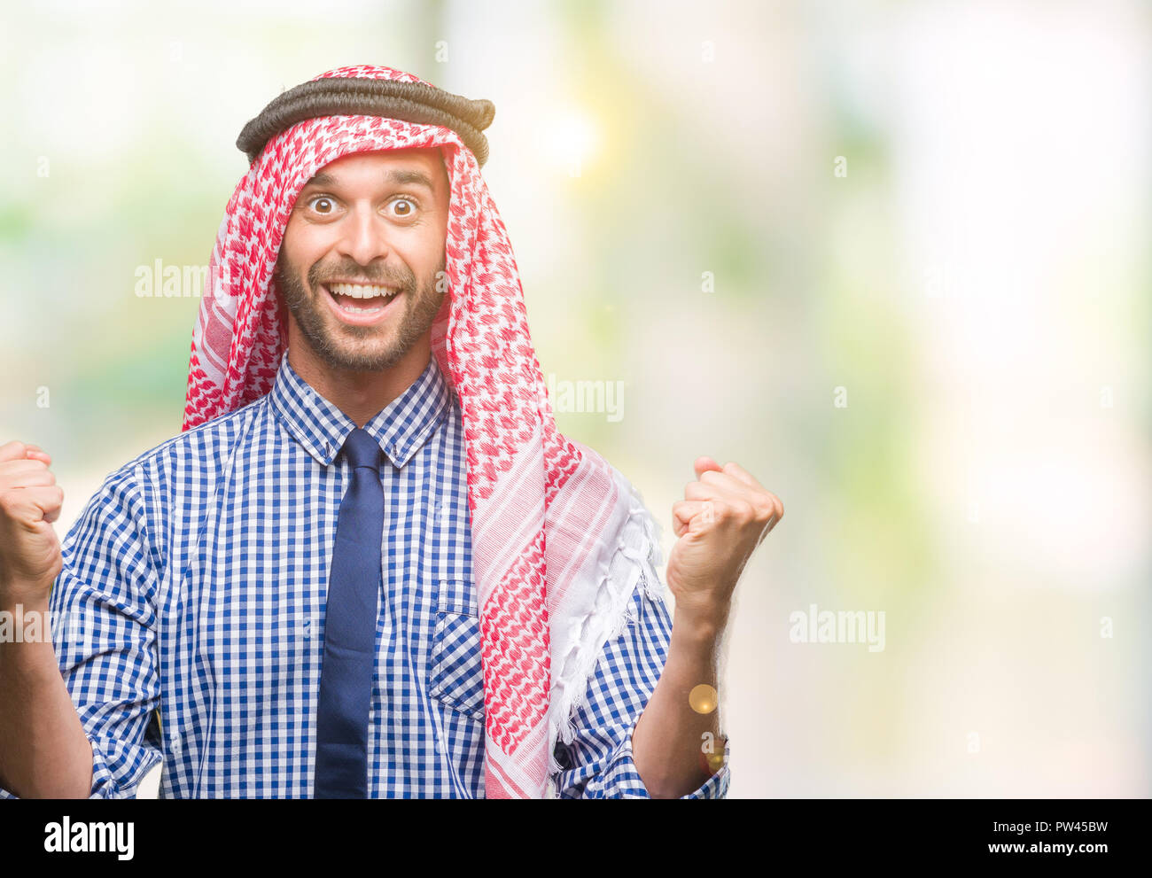 Young handsome arabian business man wearing keffiyeh over isolated ...