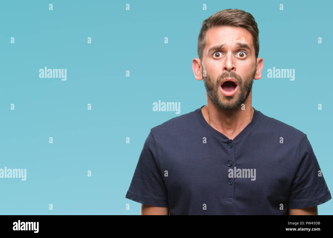 Young handsome man over isolated background afraid and shocked with surprise expression, fear ...