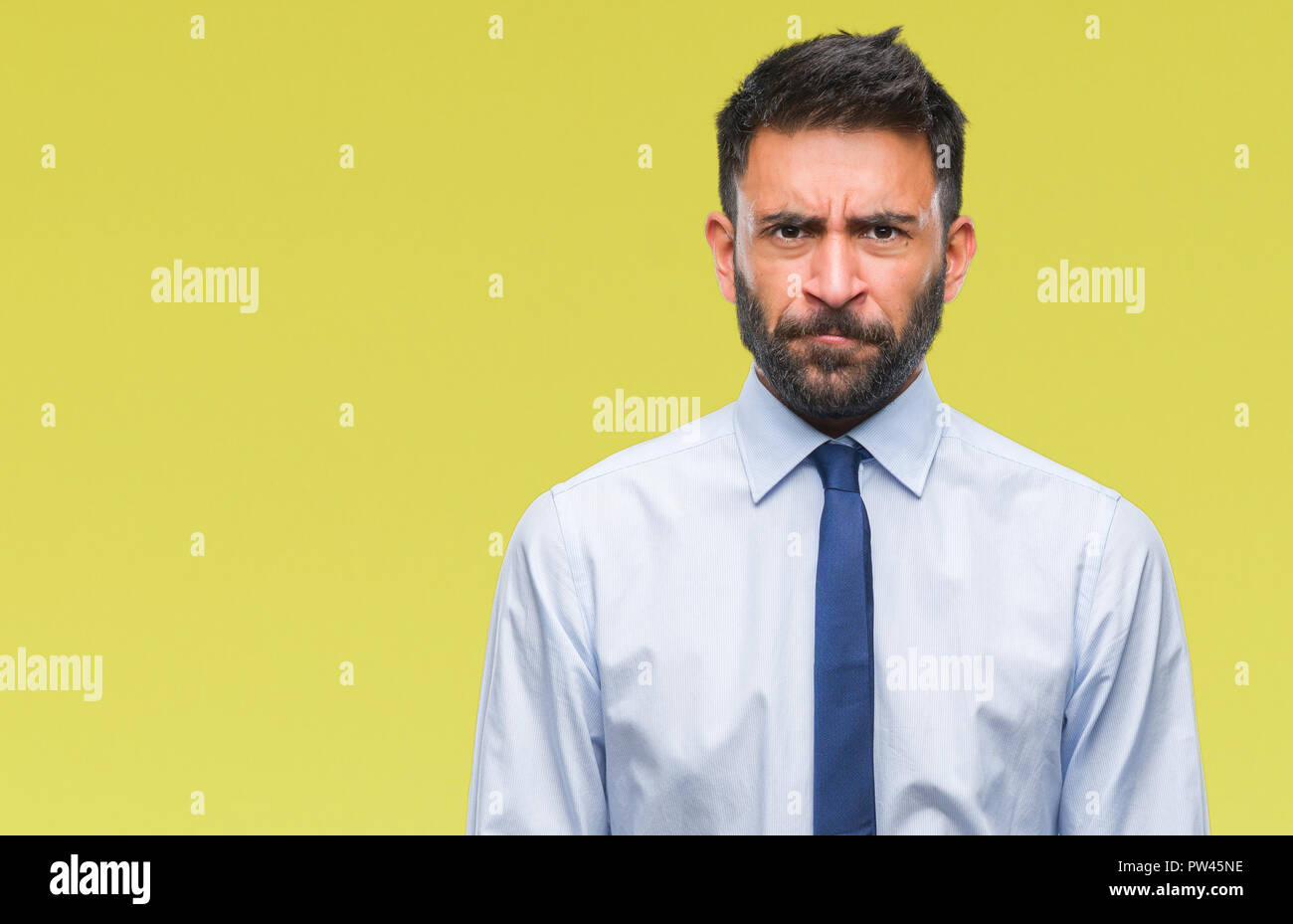 Adult hispanic business man over isolated background skeptic and ...