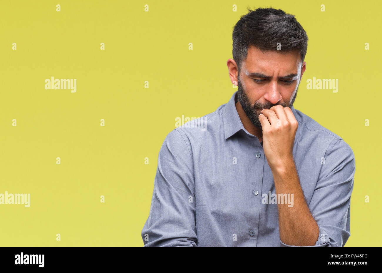 Adult hispanic man over isolated background looking stressed and ...