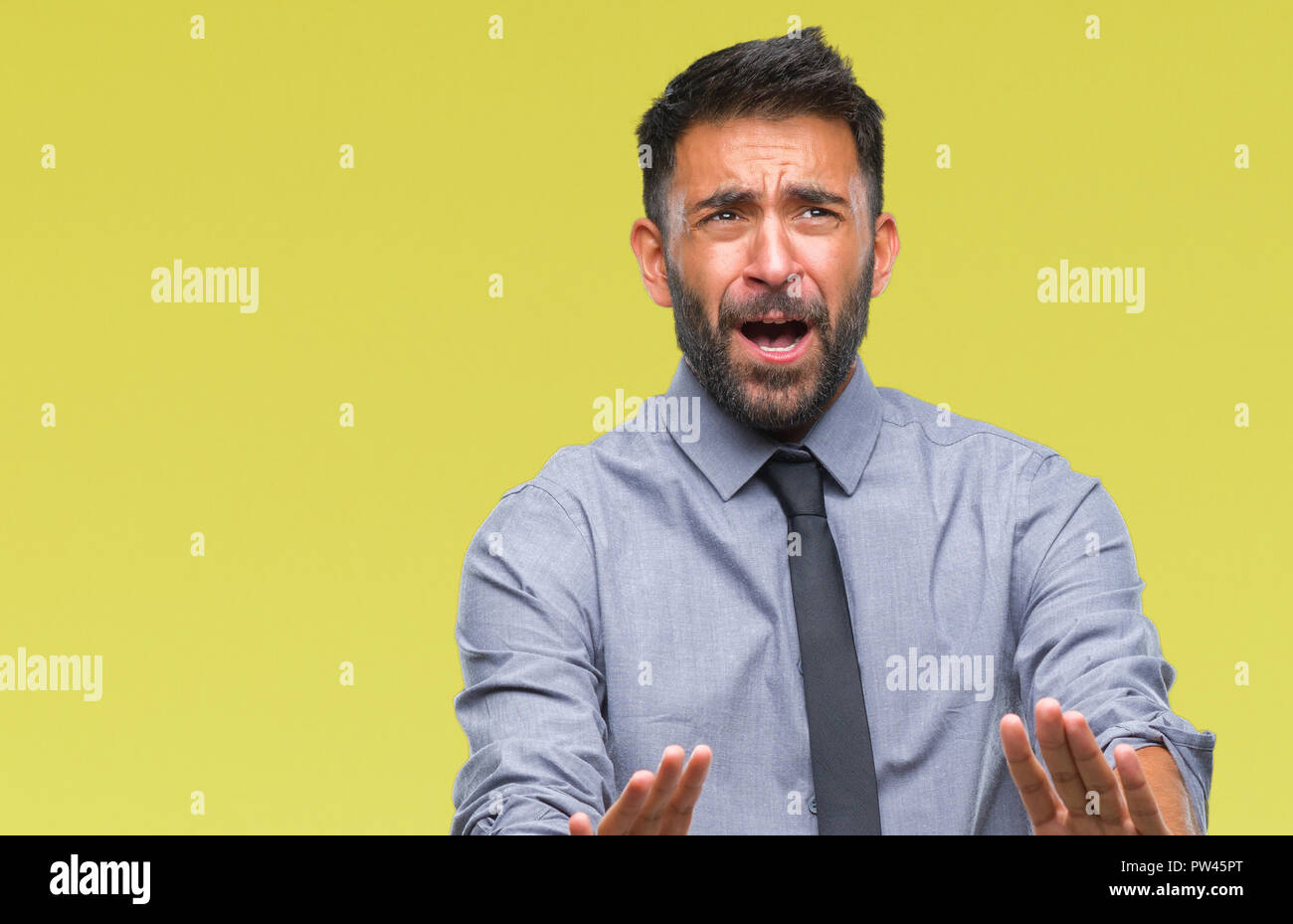 Adult hispanic business man over isolated background afraid and ...