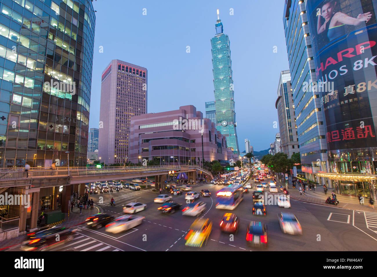 Taiwan, Taipei, traffic in front of Taipei 101 at a busy downtown ...