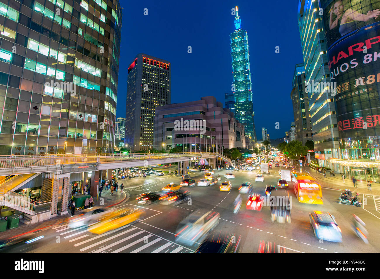 Taiwan, Taipei, traffic in front of Taipei 101 at a busy downtown ...