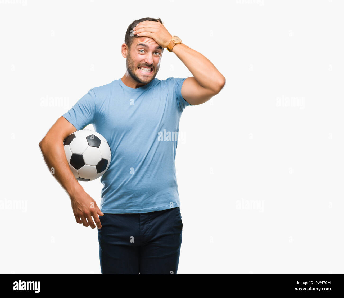 Young handsome man holding soccer football ball over isolated ...