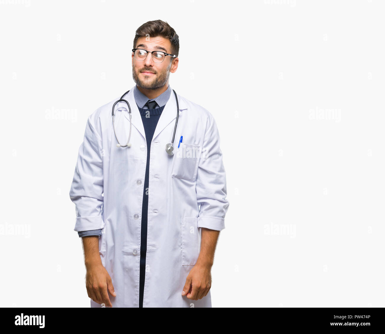 Young handsome doctor man over isolated background smiling looking side ...