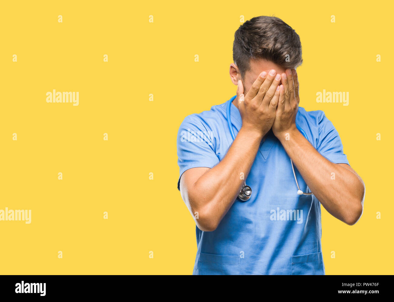 Young handsome doctor surgeon man over isolated background with sad ...