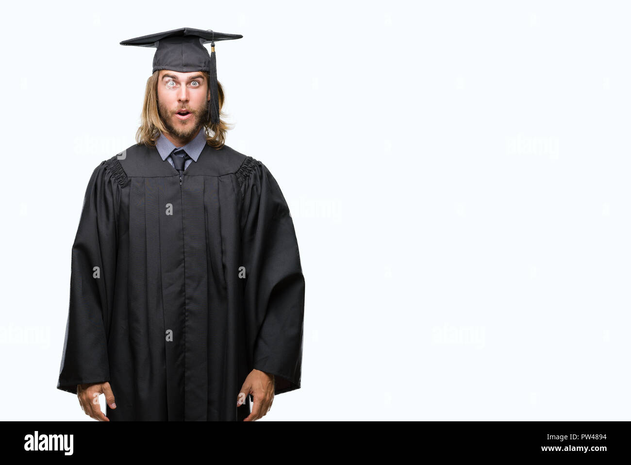 Young handsome graduated man with long hair over isolated background ...