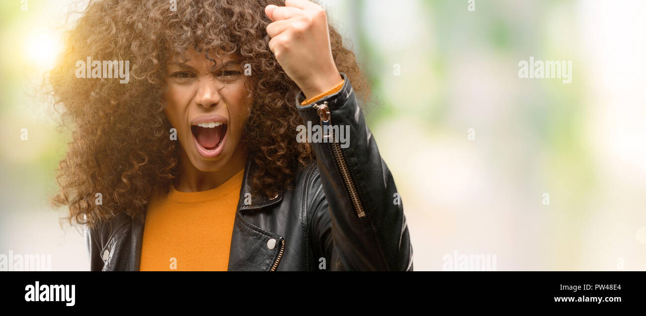 African american woman wearing a leather jacket annoyed and frustrated ...