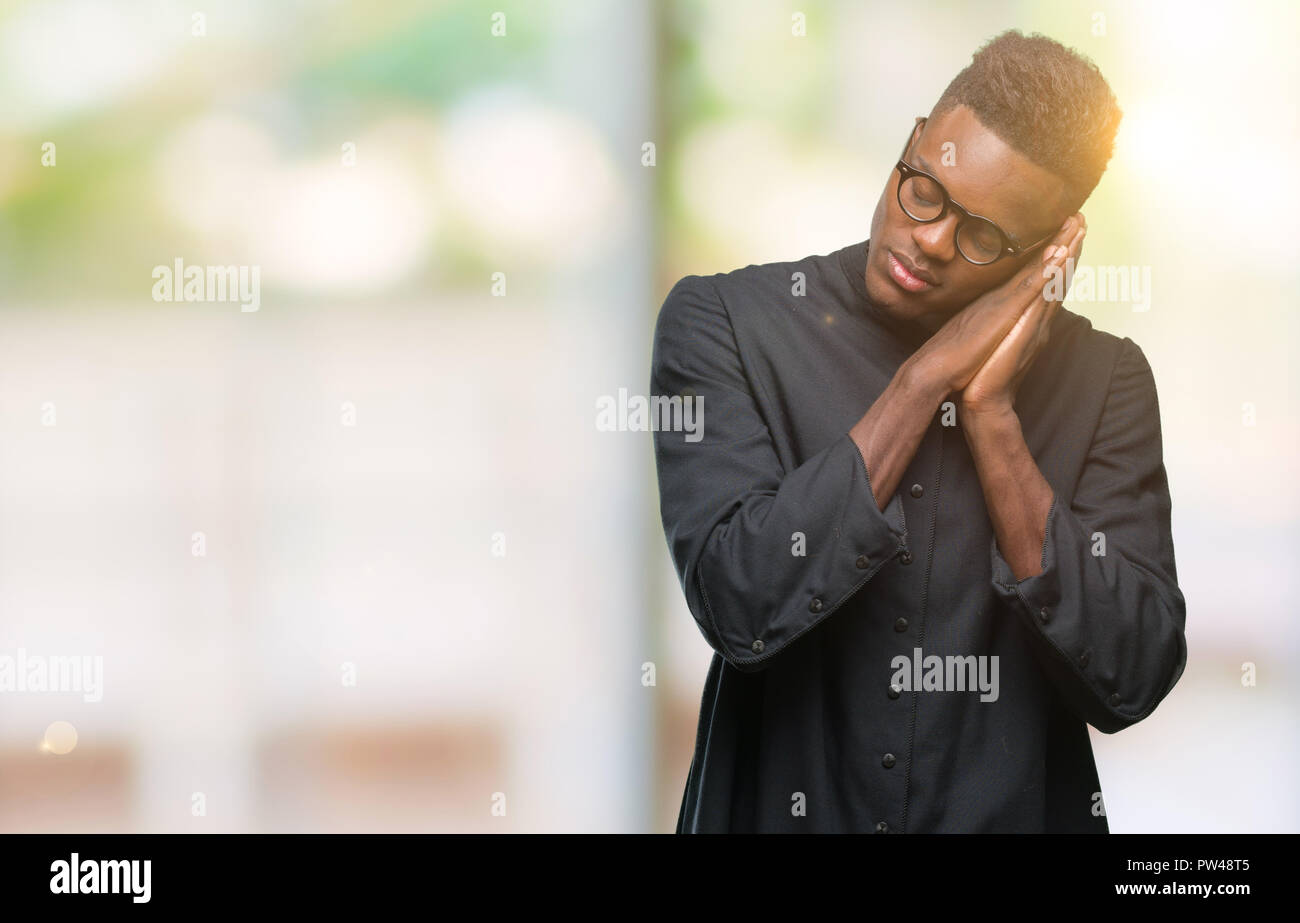 Young african american priest man over isolated background sleeping ...