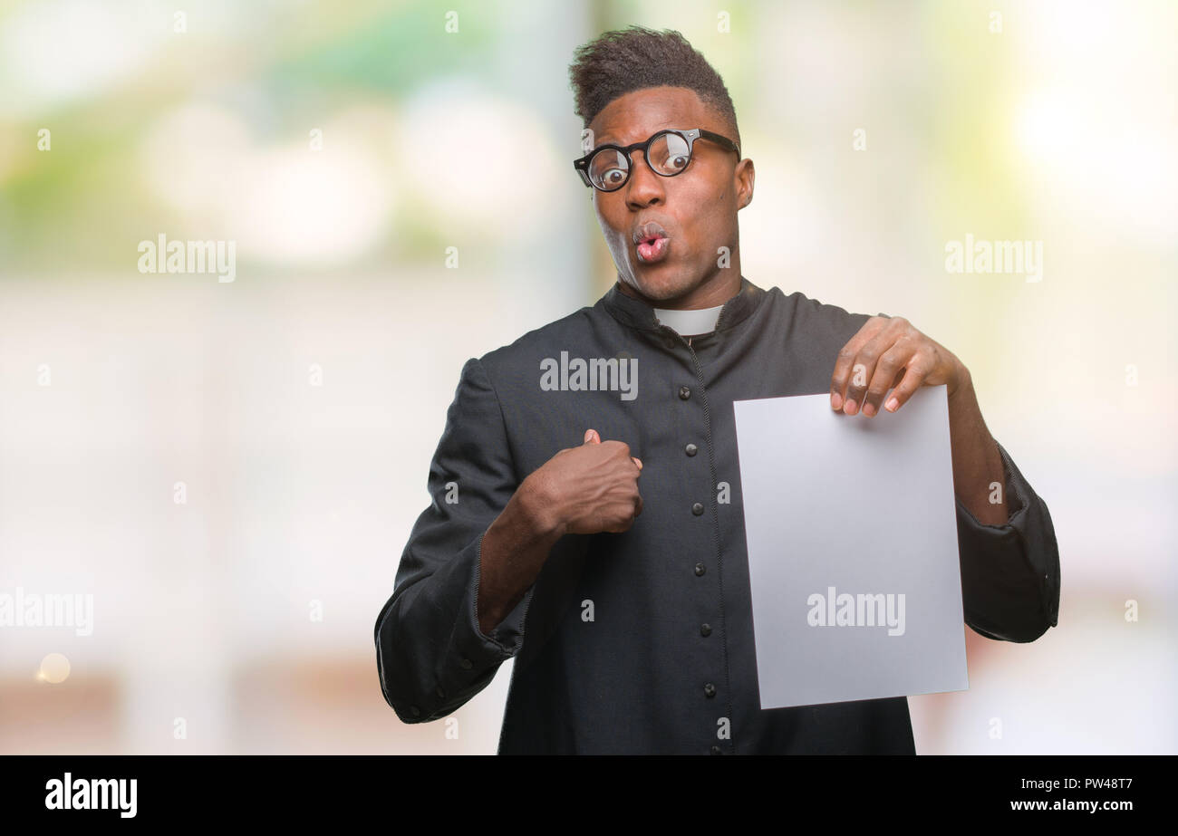 Young african american priest man over isolated background holding ...