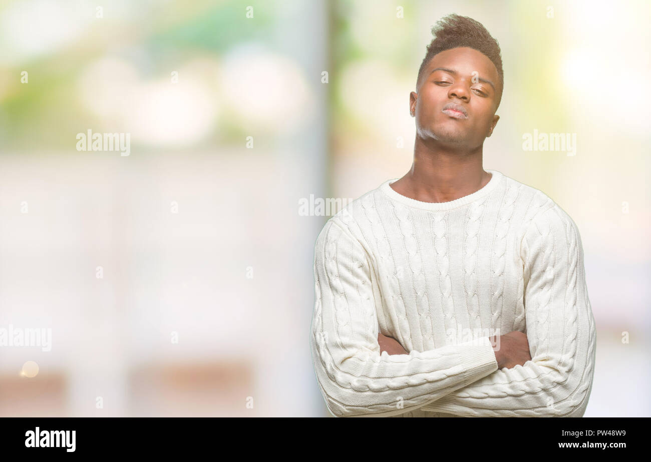 Young african american man over isolated background skeptic and nervous ...