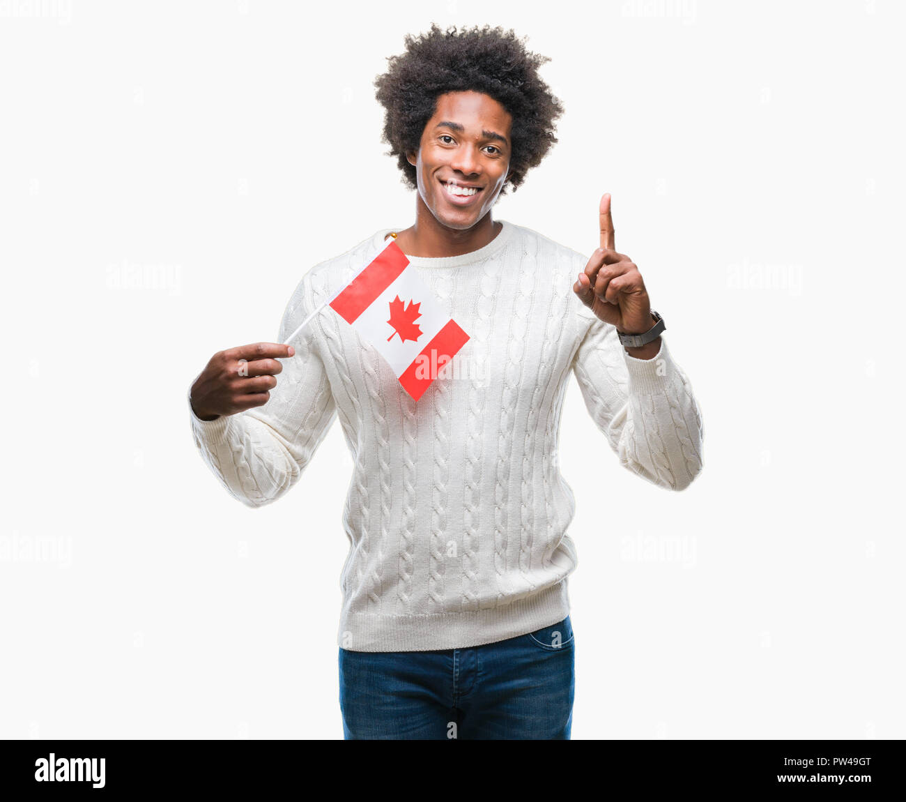 Afro american man flag of Canada over isolated background surprised ...