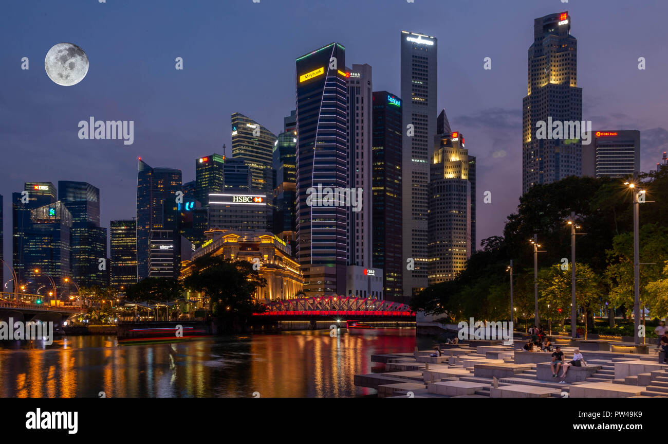 Moon over Singapore skyline Stock Photo - Alamy