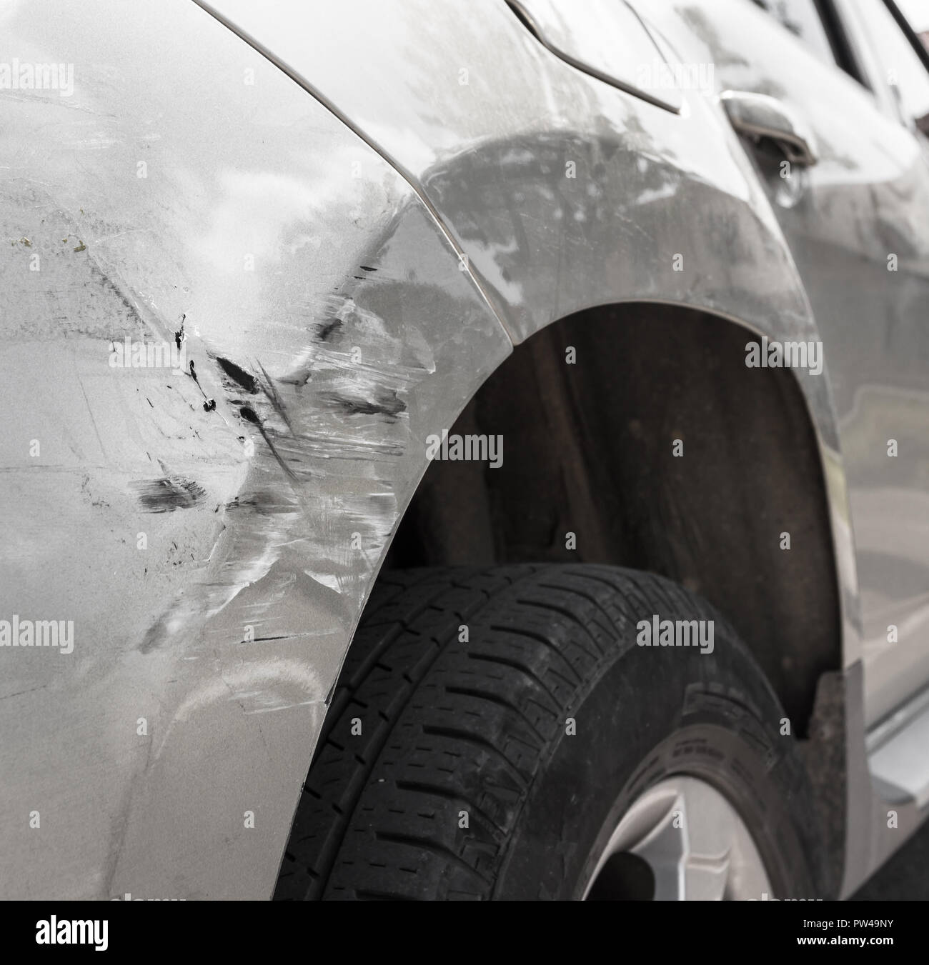 Dents on the car caused by the accident. Close-up Stock Photo - Alamy