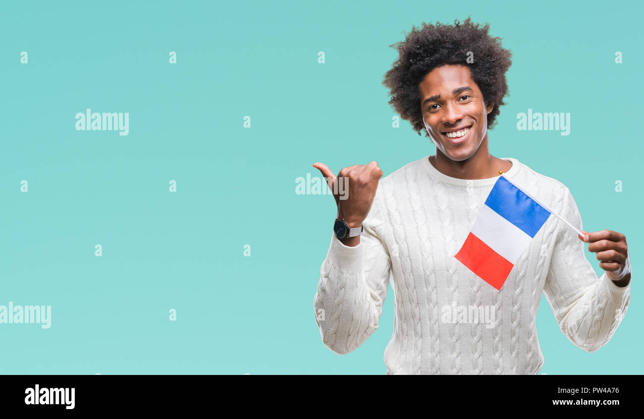 Afro american man flag of France over isolated background pointing and ...
