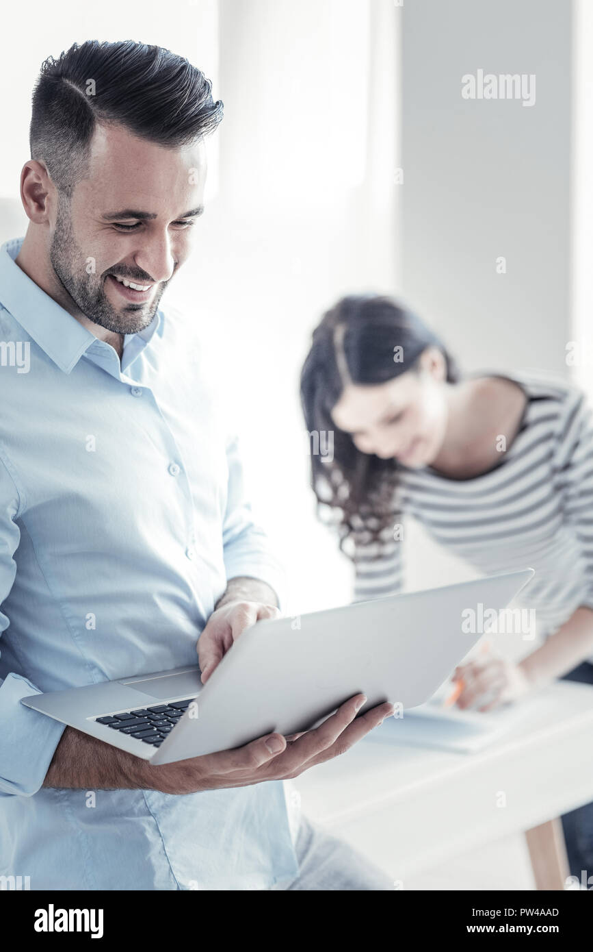 Handsome male person typing message Stock Photo - Alamy