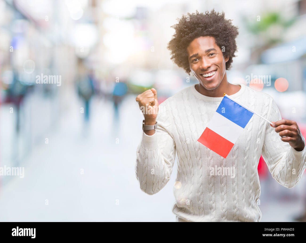 Afro american man flag of France over isolated background screaming ...