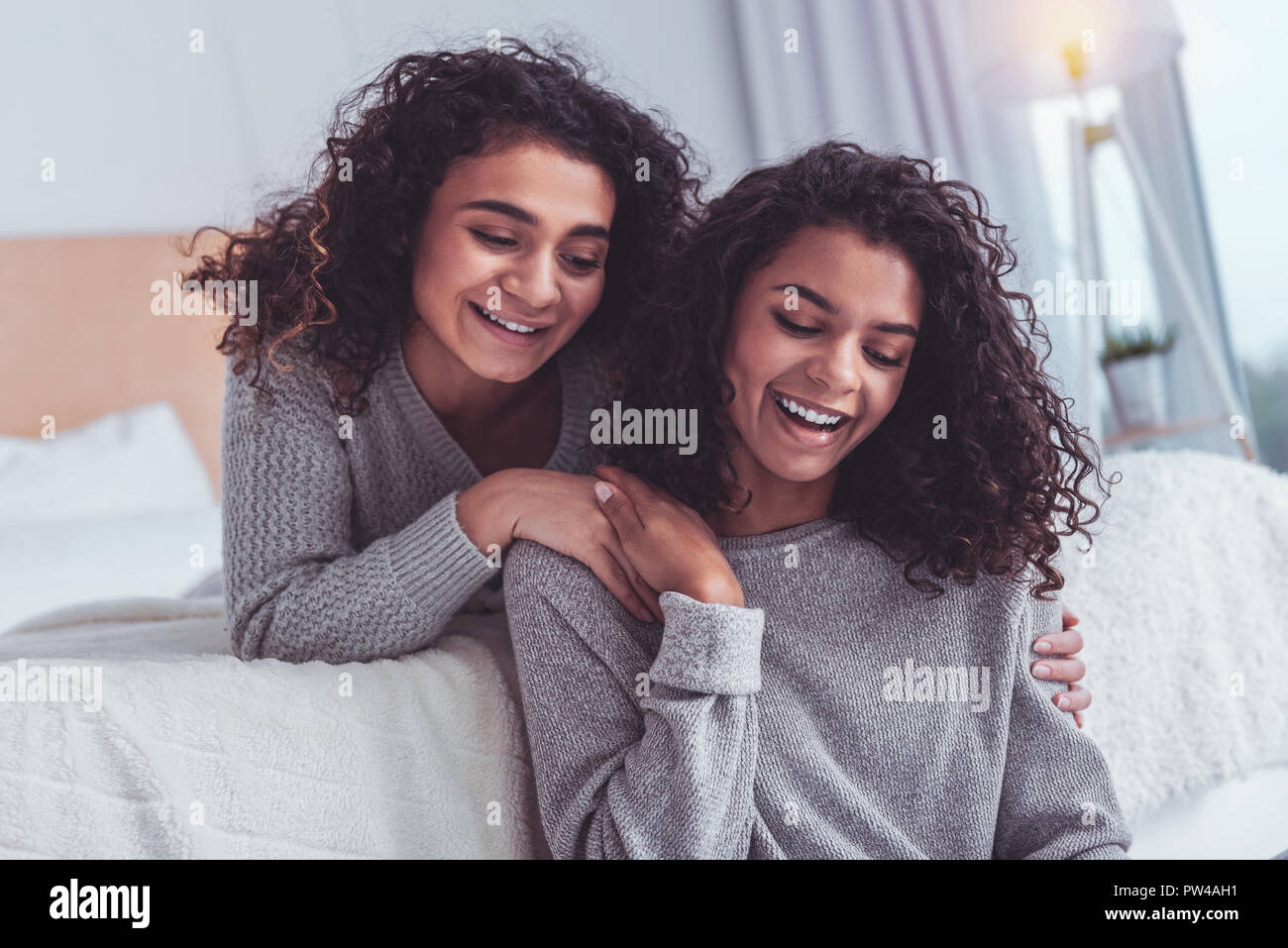 Charming smiling siblings spending leisure time together Stock Photo ...