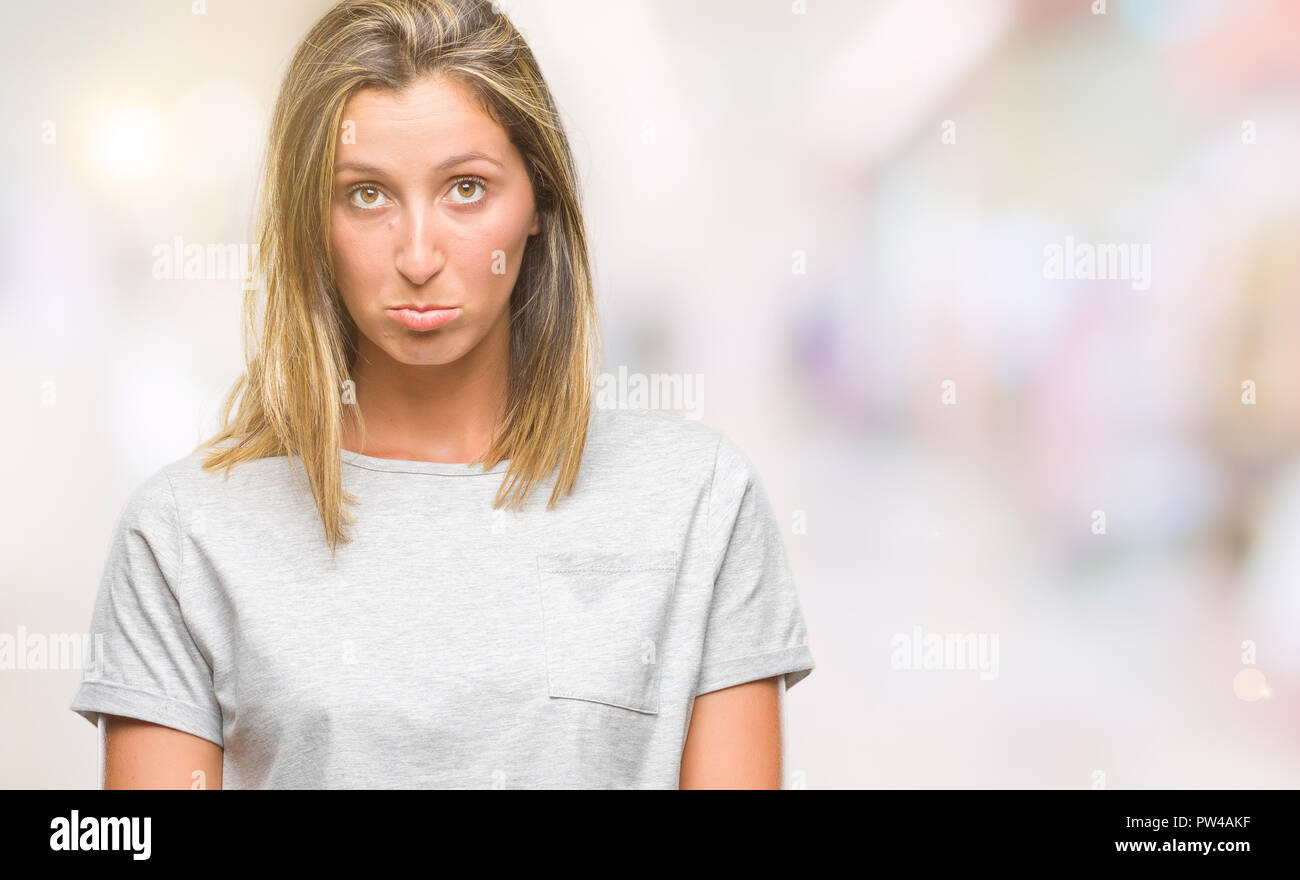 Young beautiful woman over isolated background depressed and worry for ...