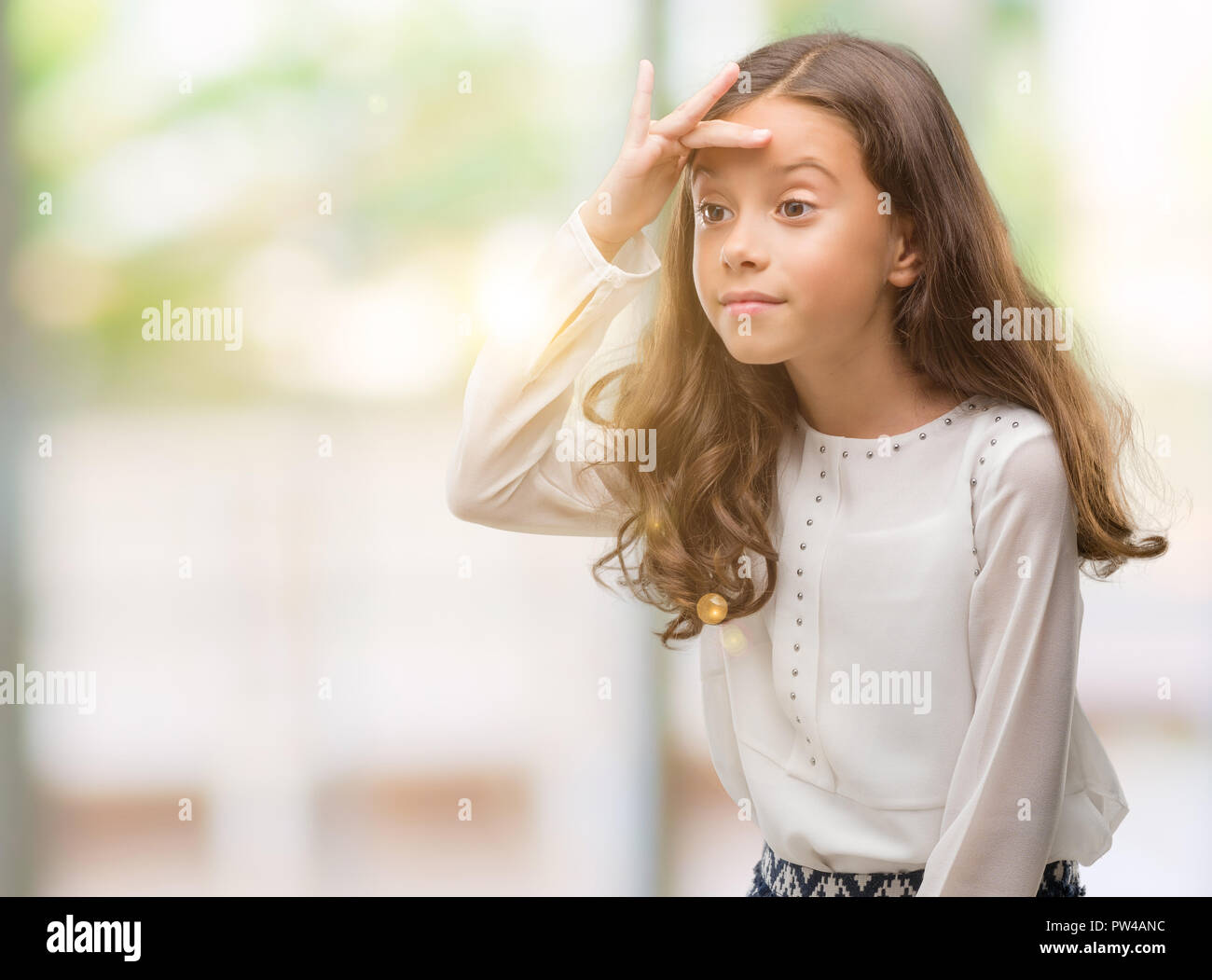 Brunette hispanic girl very happy and smiling looking far away with ...