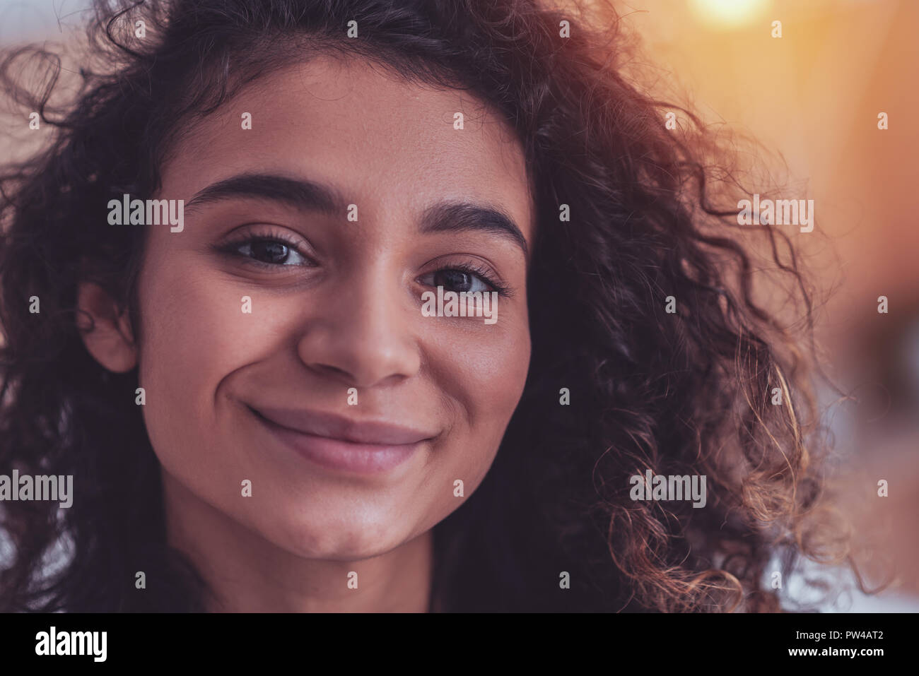 Beautiful dark-eyed girl smiling broadly Stock Photo - Alamy