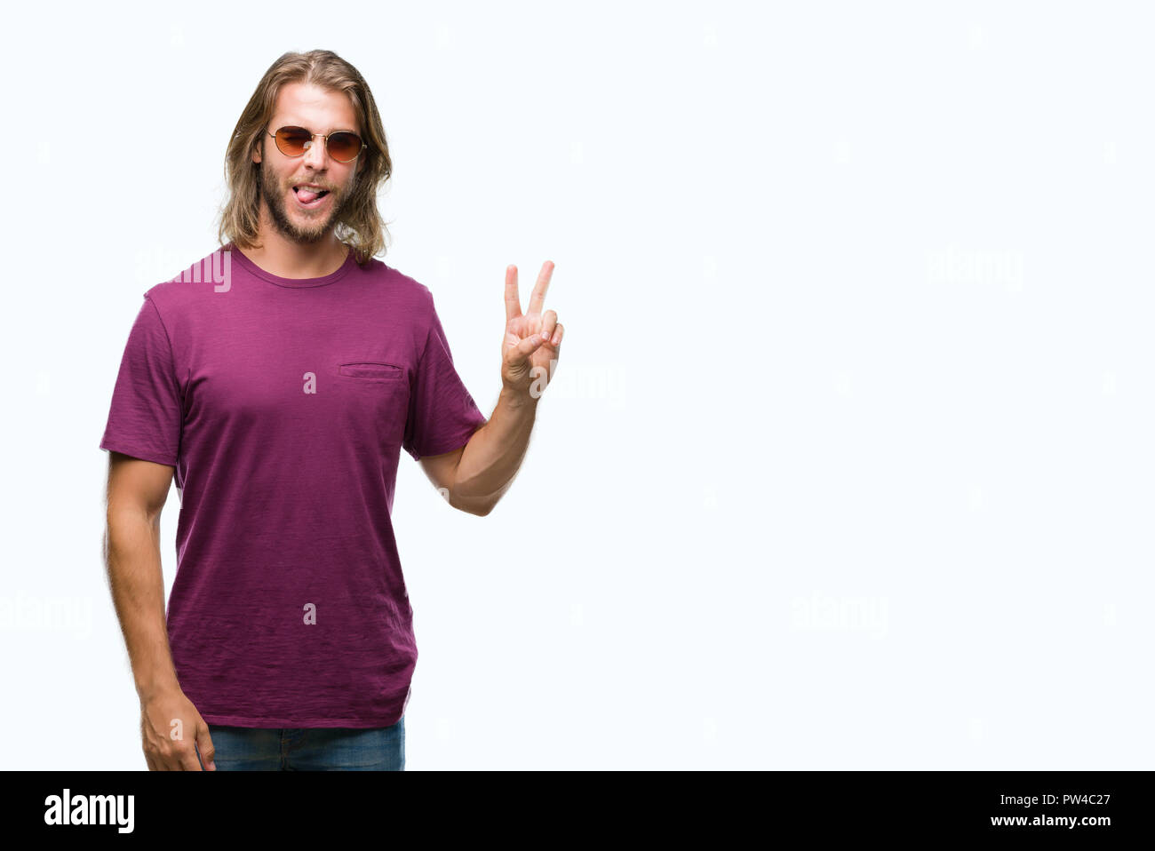 Young handsome man with long hair wearing sunglasses over isolated ...