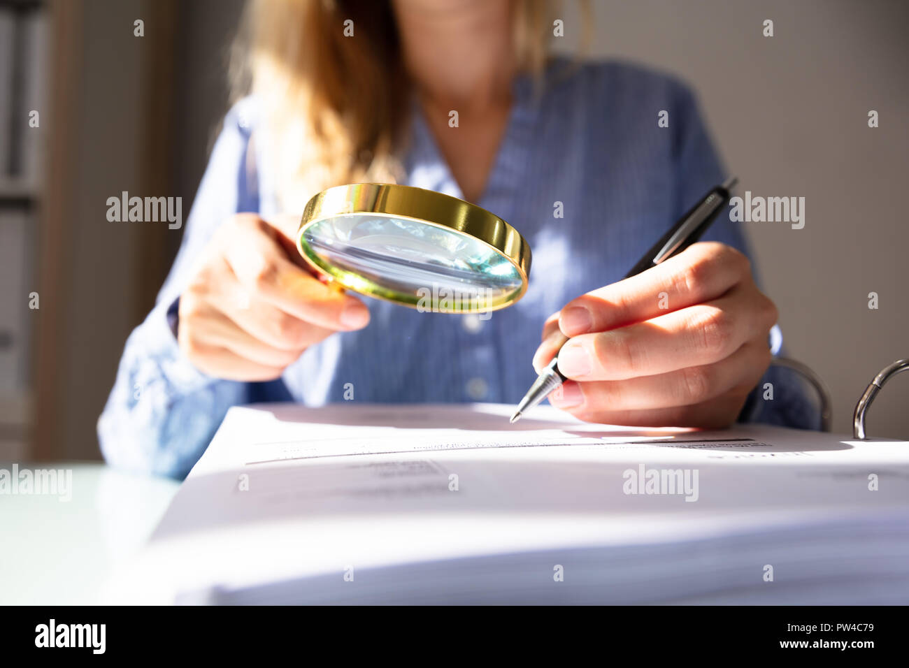 Close-up Of A Businesswoman's Hand Checking Invoice With Magnifying ...