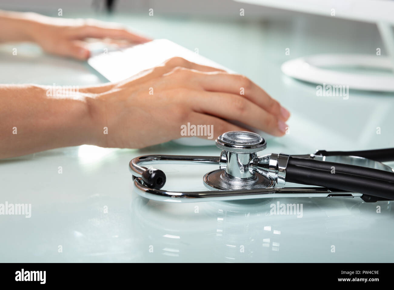 Close-up Of A Female Doctor's Hand Using Computer Keyboard Near ...