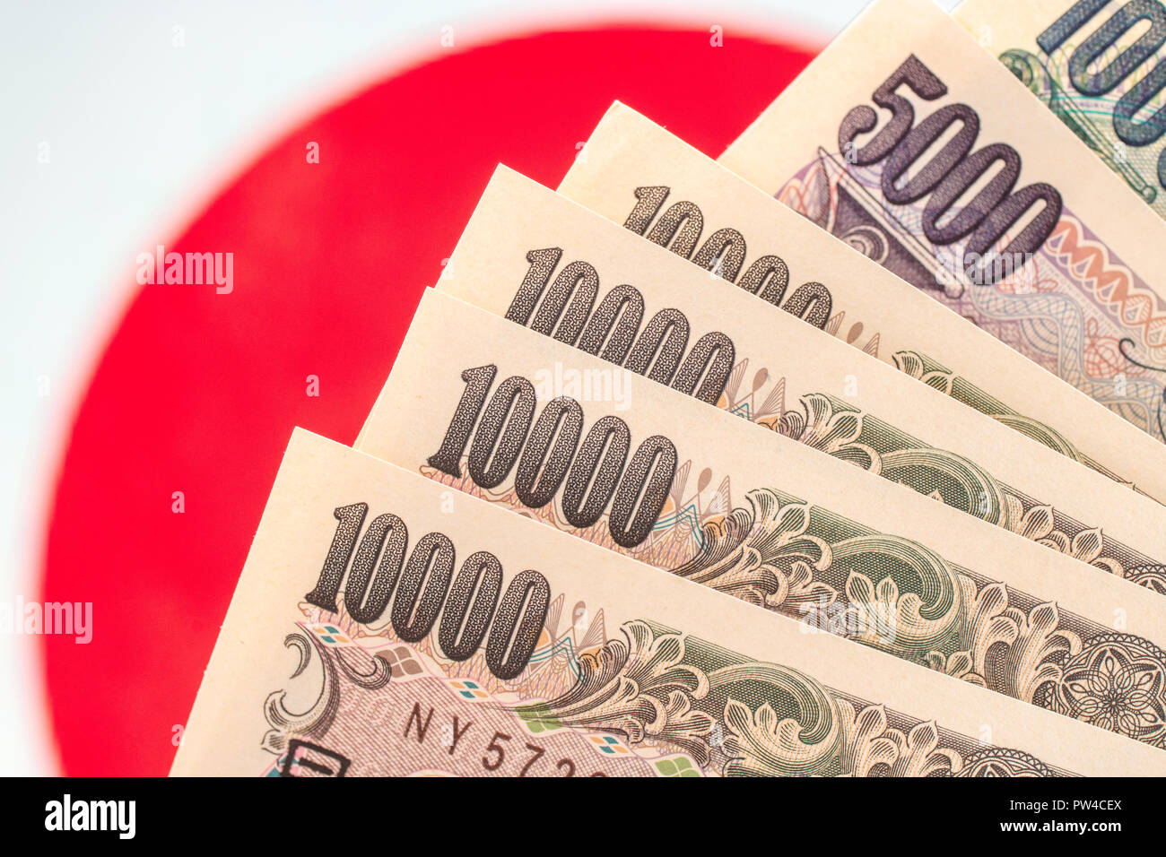 Japanese currency notes , Japanese Yen on japanese flag Stock Photo - Alamy