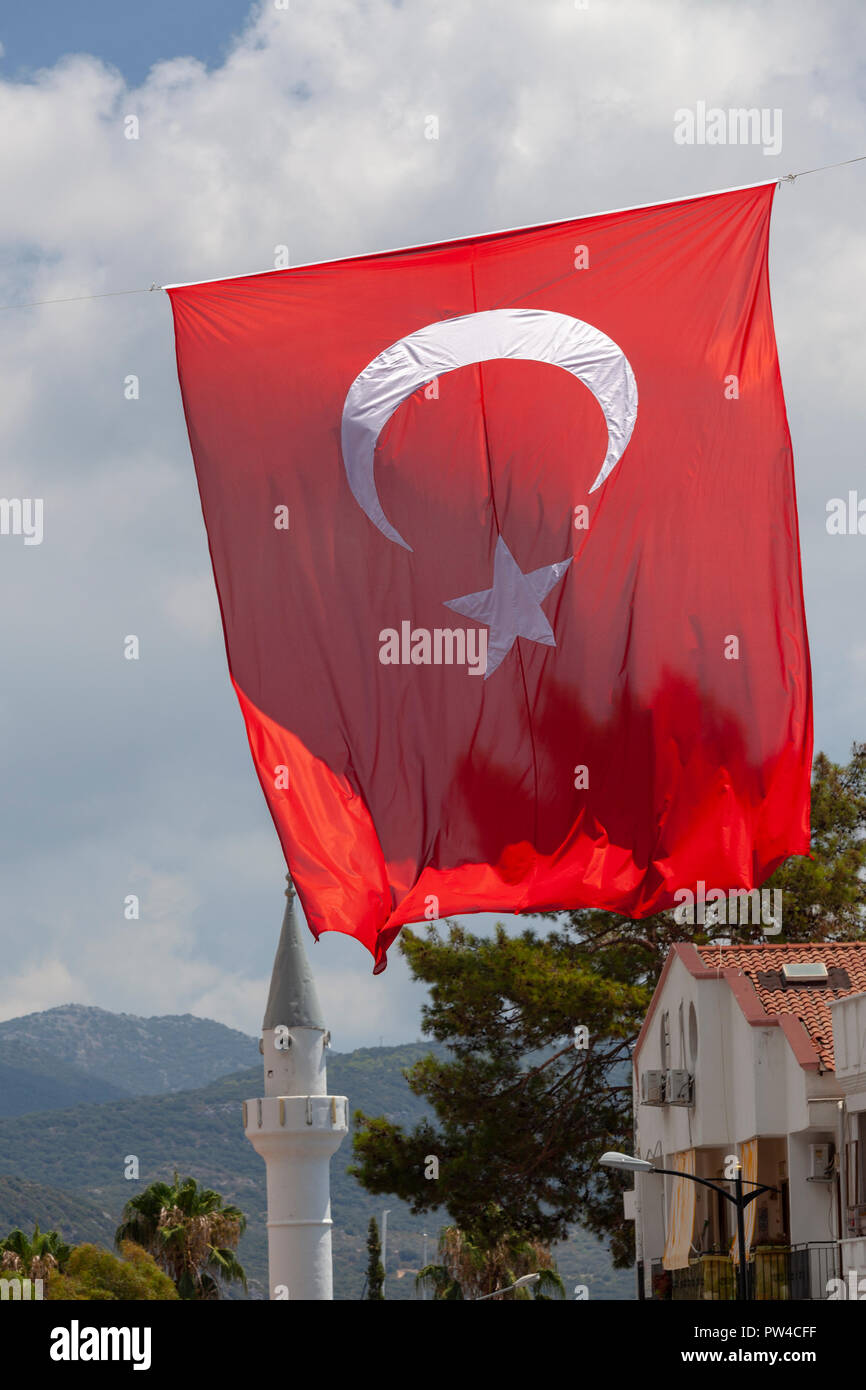 Turkish flag flying over street scene in Kas, Turkey Stock Photo - Alamy