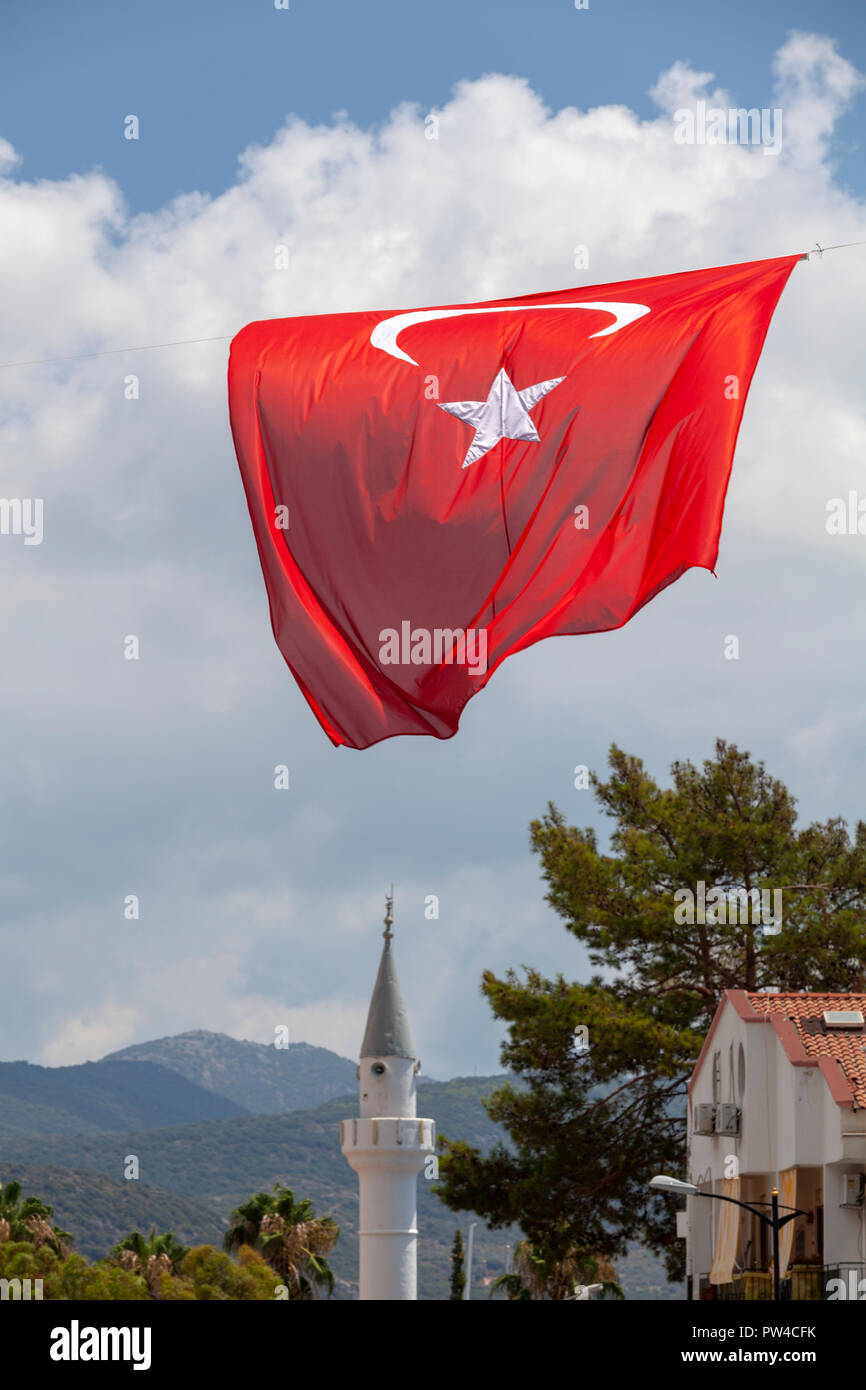 Turkish flag flying over street scene in Kas, Turkey Stock Photo - Alamy