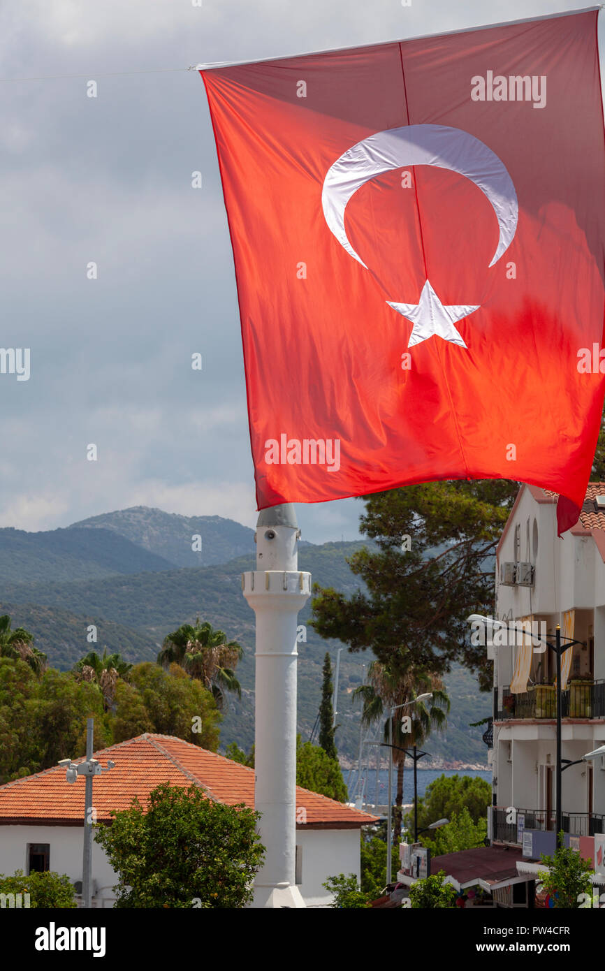 Turkish flag flying over street scene in Kas, Turkey Stock Photo - Alamy