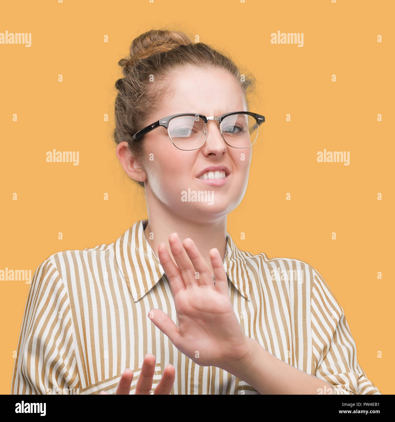 Young blonde business woman disgusted expression, displeased and ...