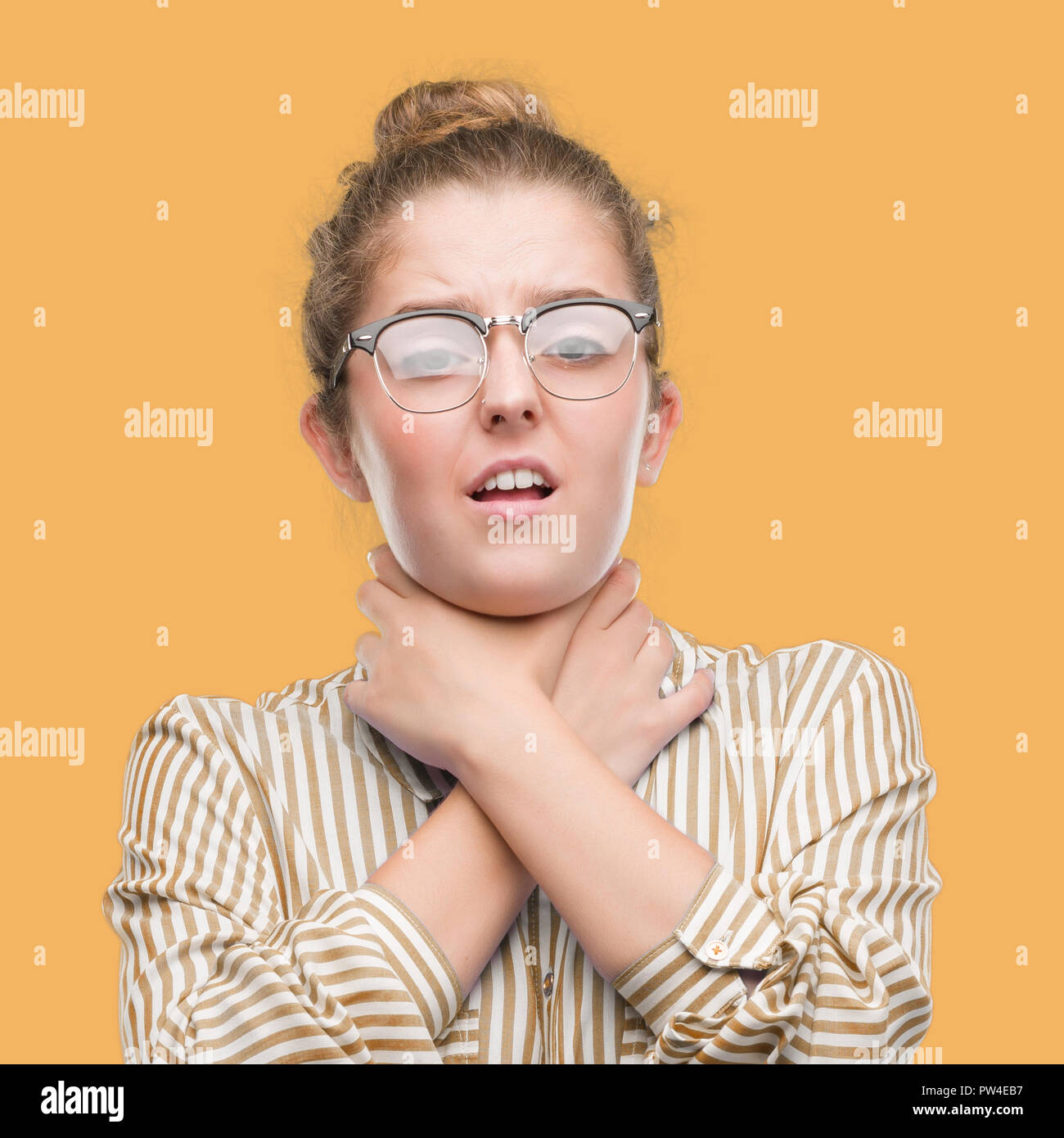 Young blonde business woman shouting and suffocate because painful ...